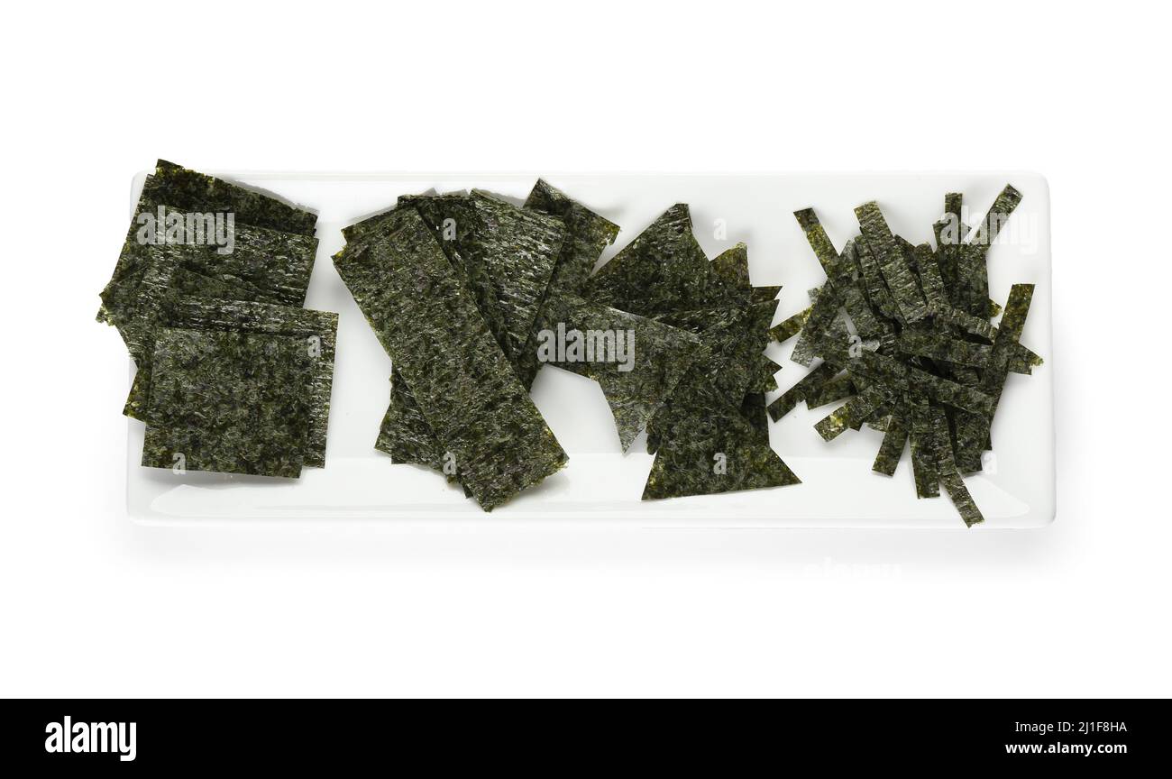 Plate with tasty seaweed sheets on white background Stock Photo - Alamy