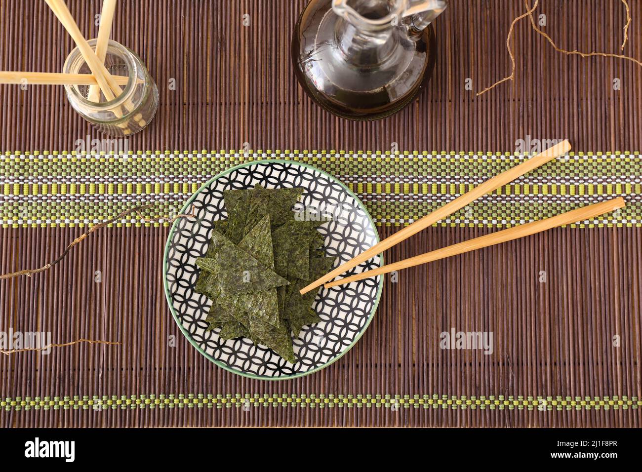Plate of tasty seaweed sheets on bamboo mat Stock Photo - Alamy