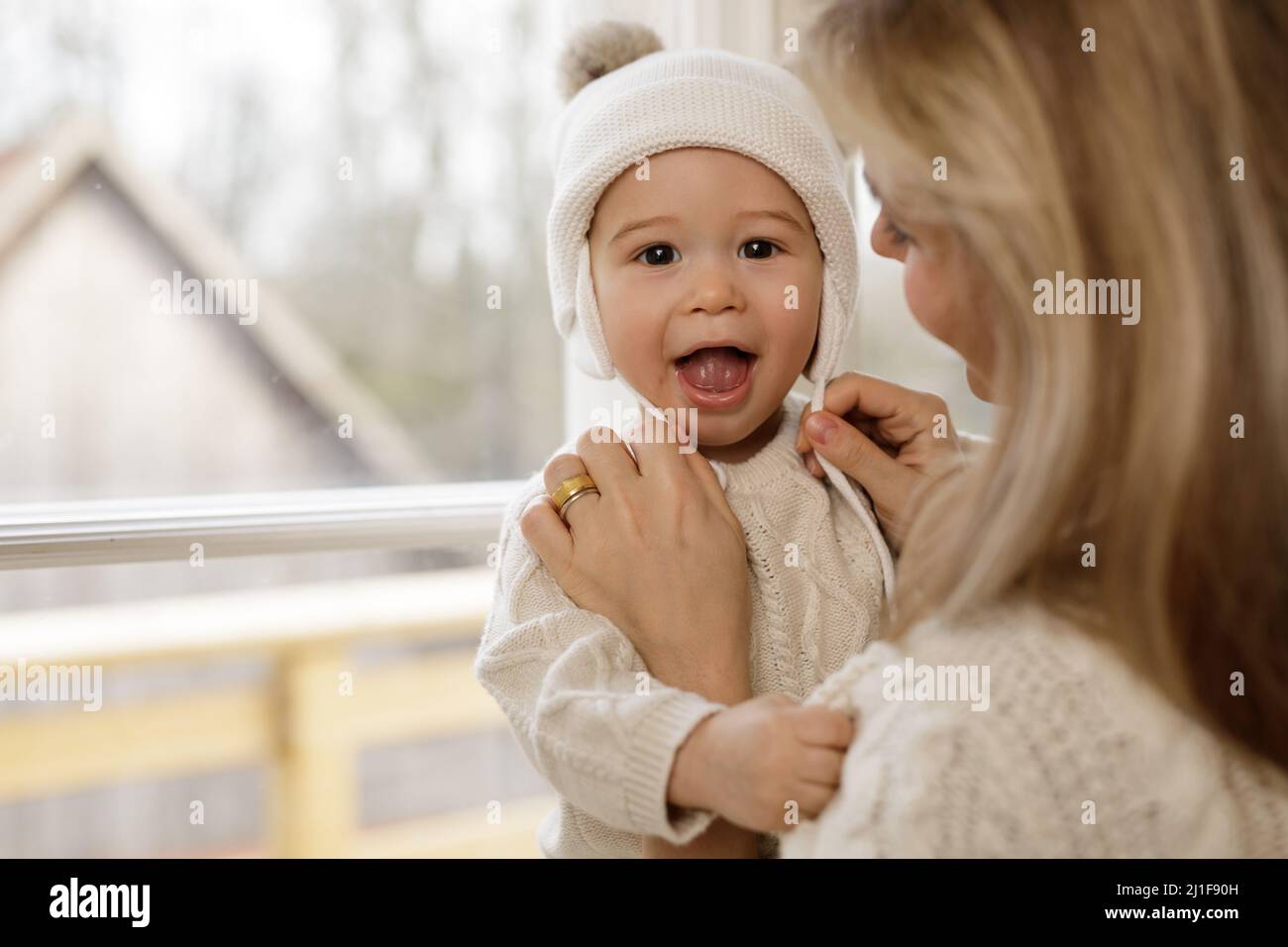 Put on hat child hi-res stock photography and images - Alamy