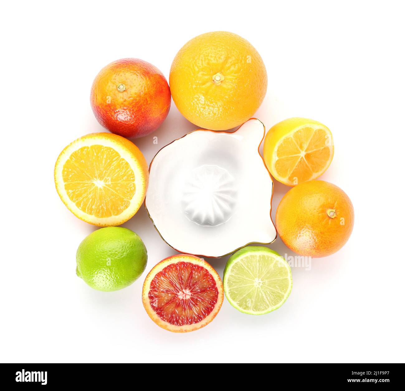 Ceramic juicer and citrus fruits on white background Stock Photo - Alamy