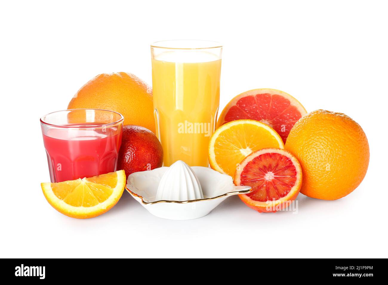 Ceramic juicer and citrus fruits on white background Stock Photo - Alamy