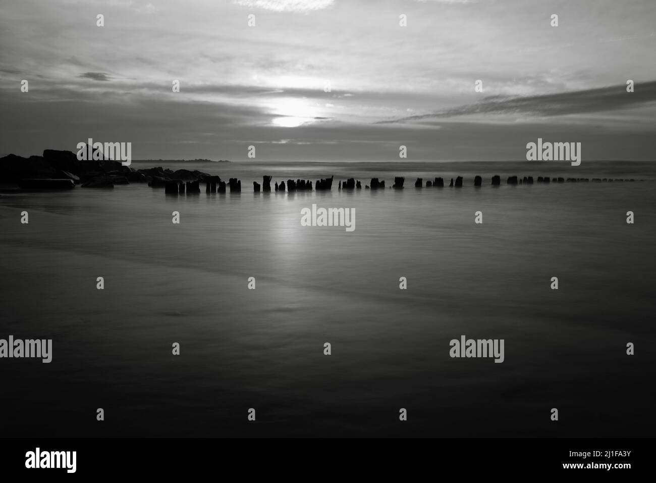 A grayscale of the sea on the sunset Stock Photo - Alamy