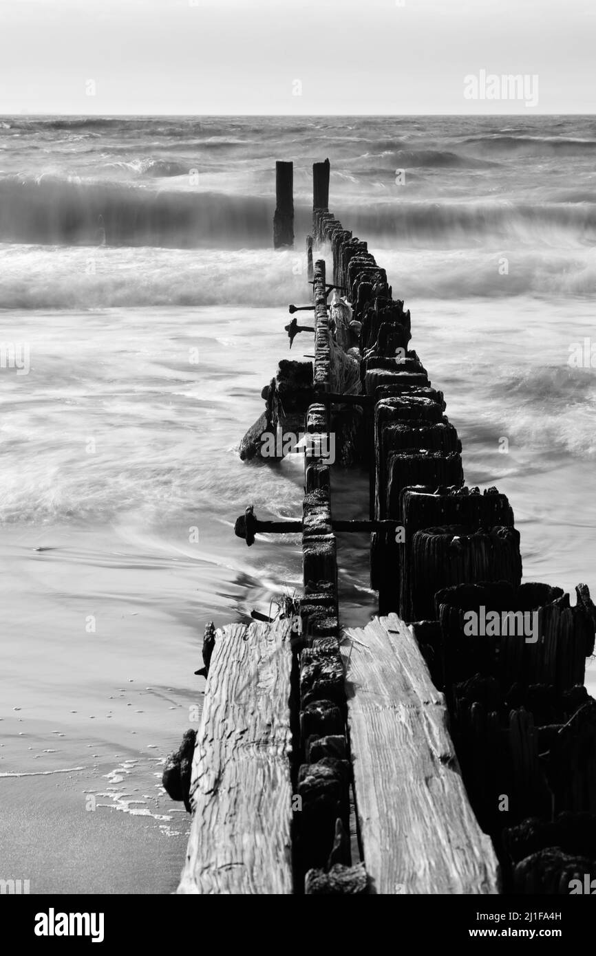 Breakwater on coast Black and White Stock Photos & Images - Alamy