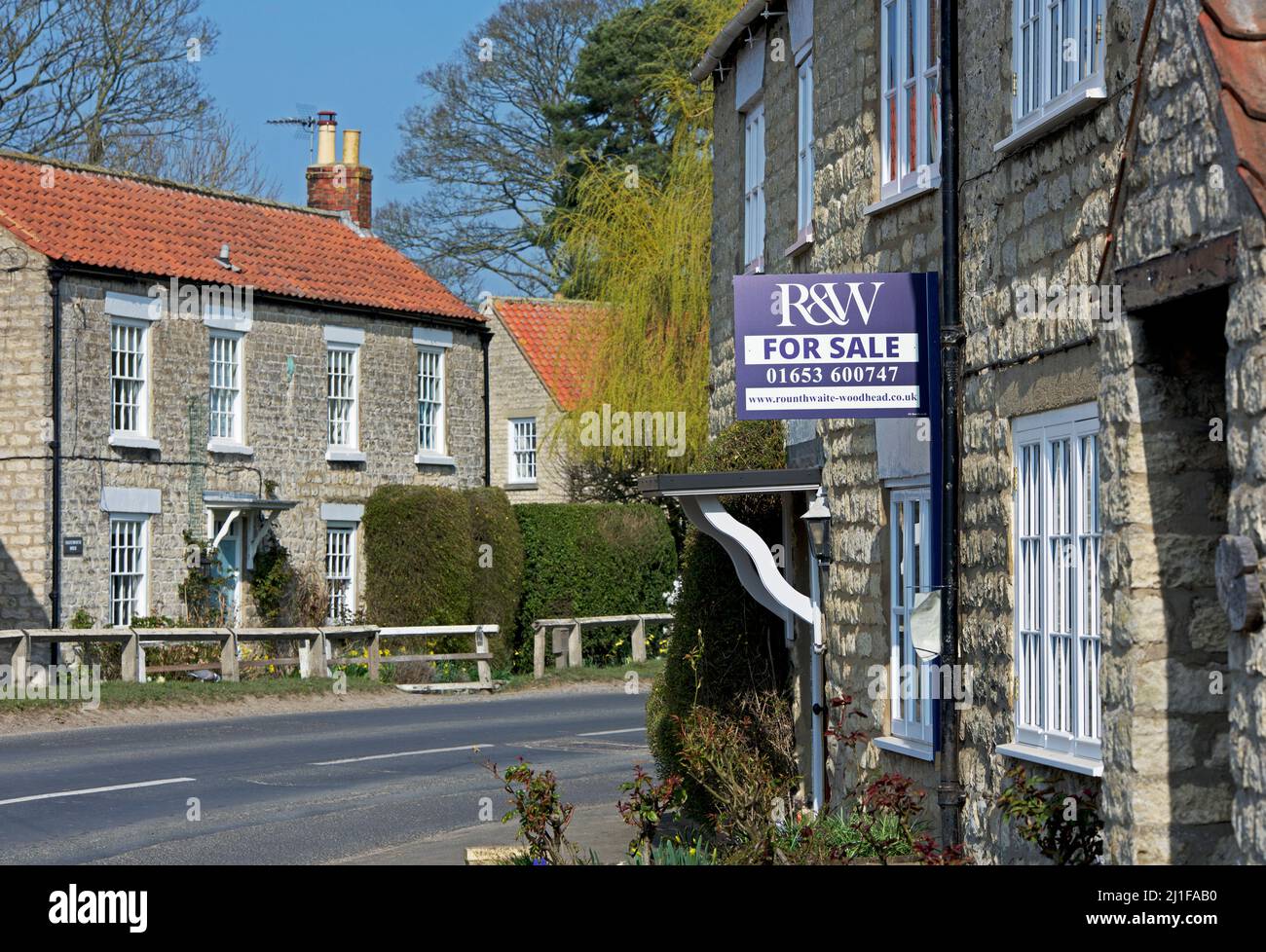 House for sale sign in the village of Hovingham in Ryedale district ...