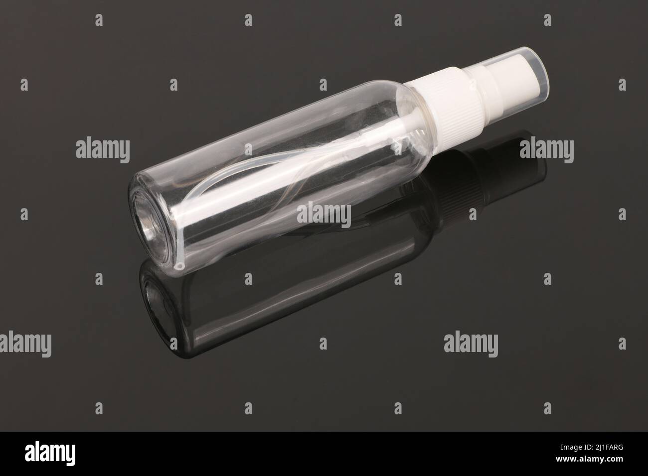 Blank pocket spray bottle with cap isolated on black. High resolution ...