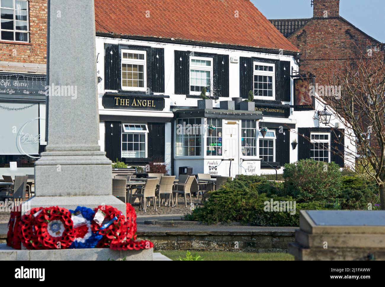 War memorial and the Angel pub, Easingwold, North Yorkshire, England UK ...