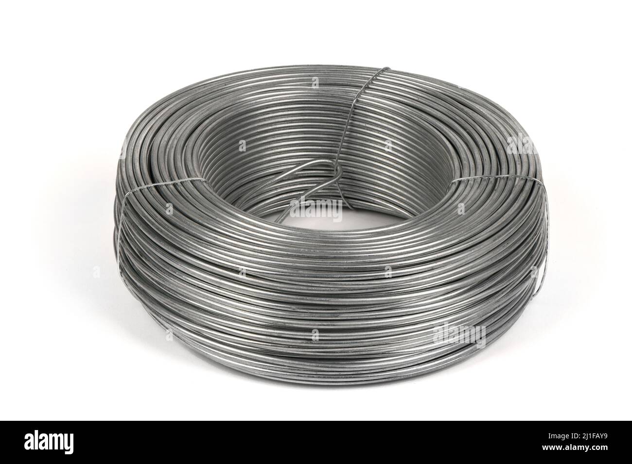Coil of galvanized wires lying on white background. High resolution ...