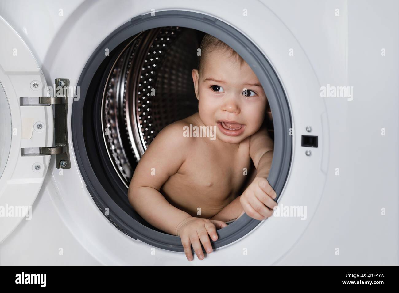 Boy hiding bathroom hi-res stock photography and images - Alamy