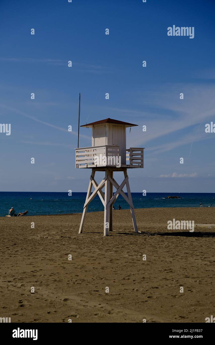 Lifeguard post under a blue sky on the beach Stock Photo - Alamy