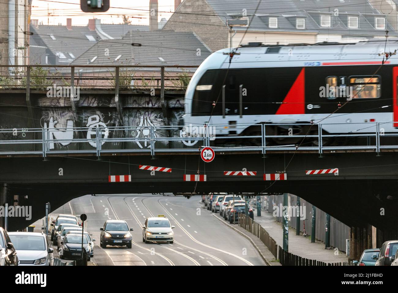 Road traffic in the early morning at the railway underpass at the main ...