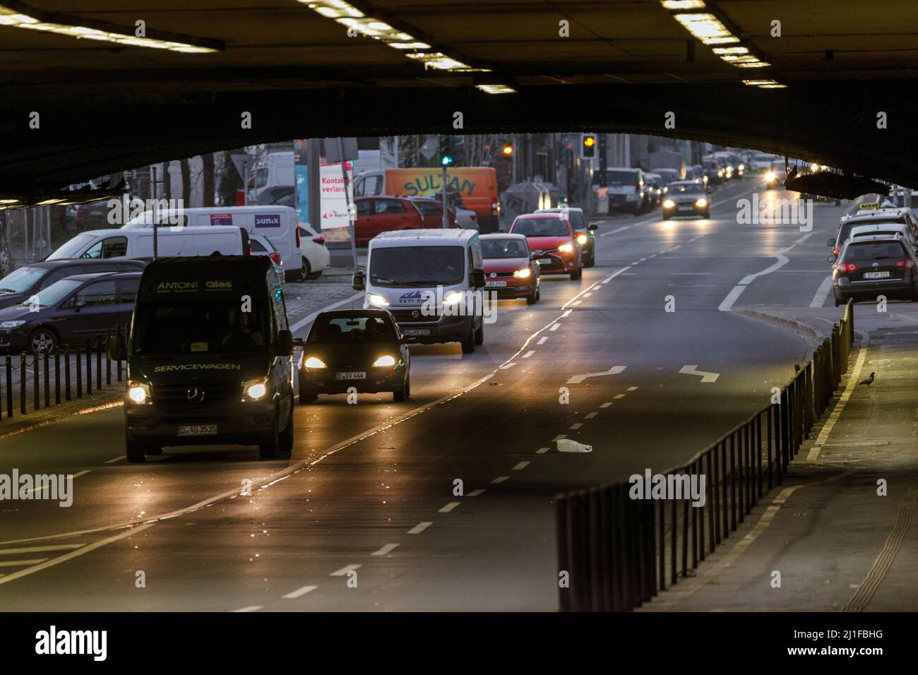 Road traffic in the early morning at the railway underpass at the main ...