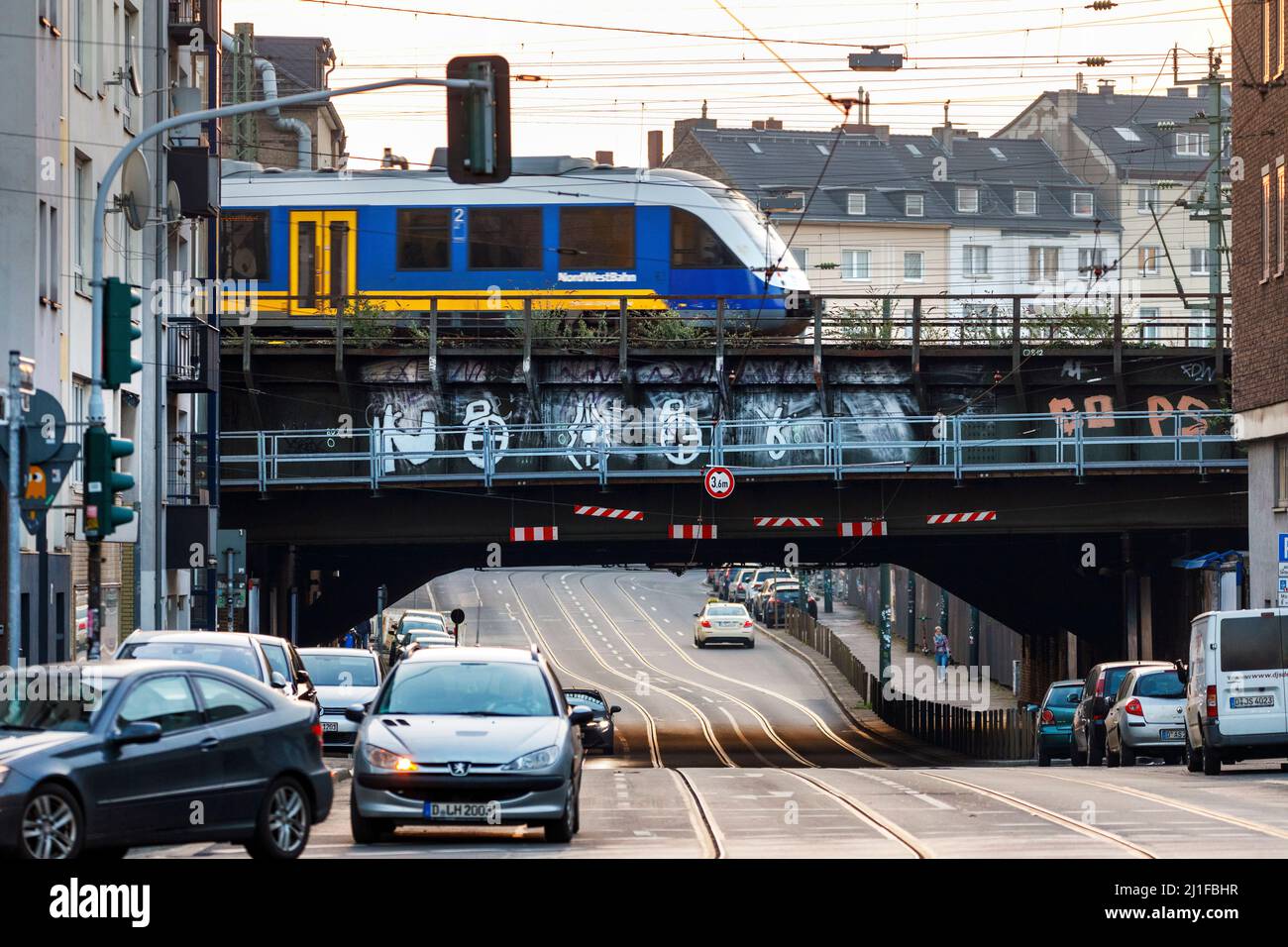 Road traffic in the early morning at the railway underpass at the main ...