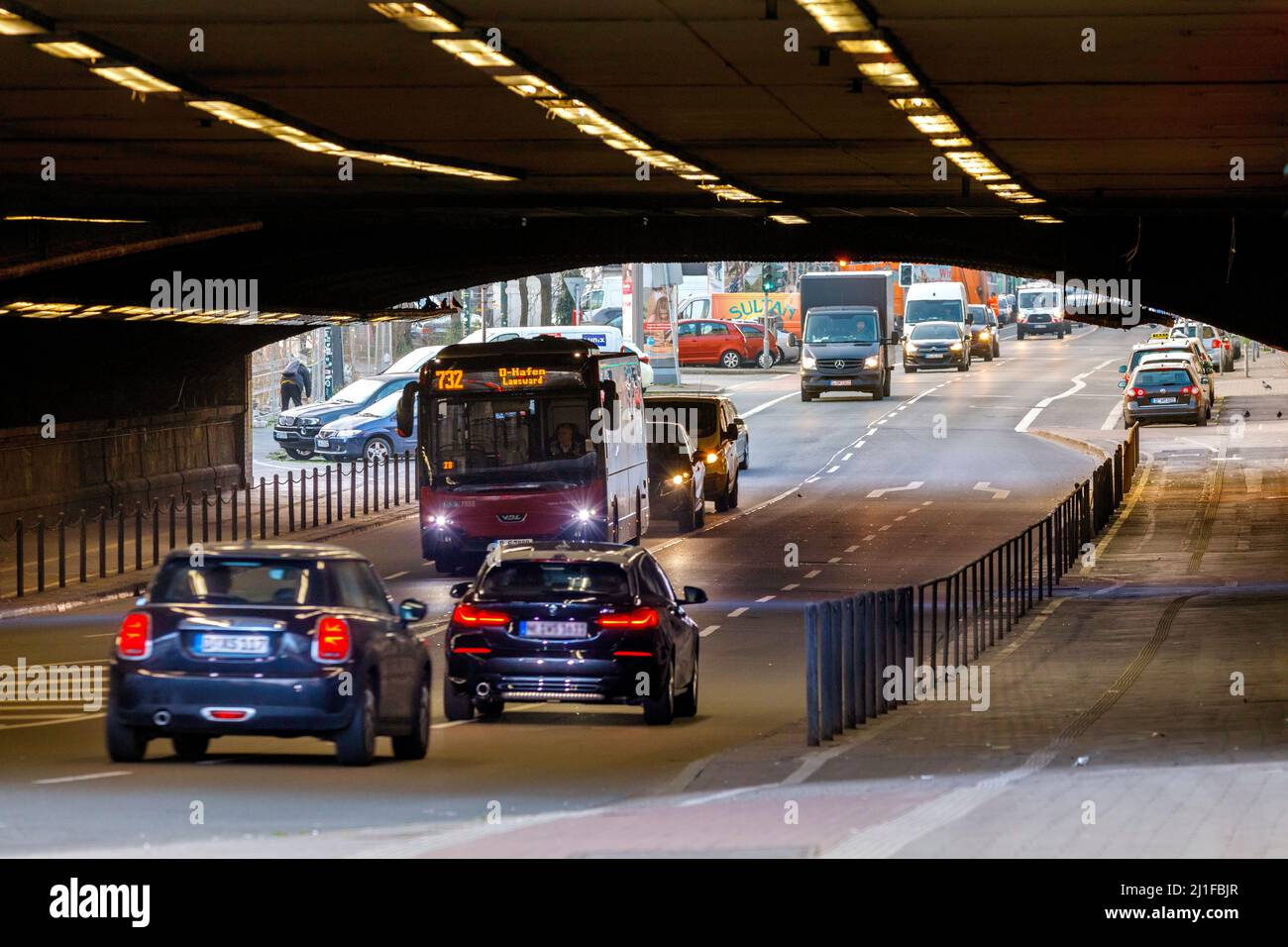 Road traffic in the early morning at the railway underpass at the main ...