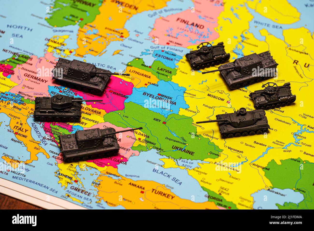 Toy tanks on the map. Concept of confrontation between NATO and Russia ...