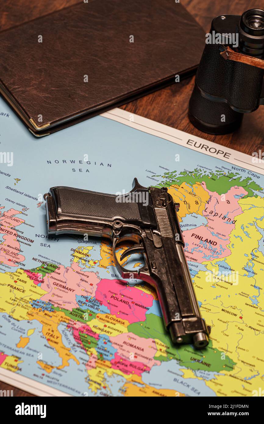 Gun on the map. Concept of military action in Europe Stock Photo - Alamy
