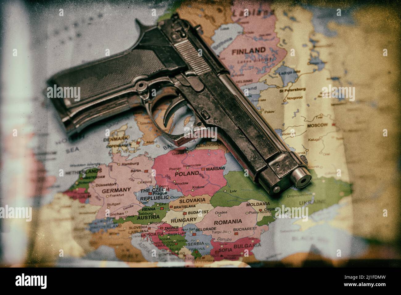 Gun on the map. Concept of military action in Europe Stock Photo - Alamy