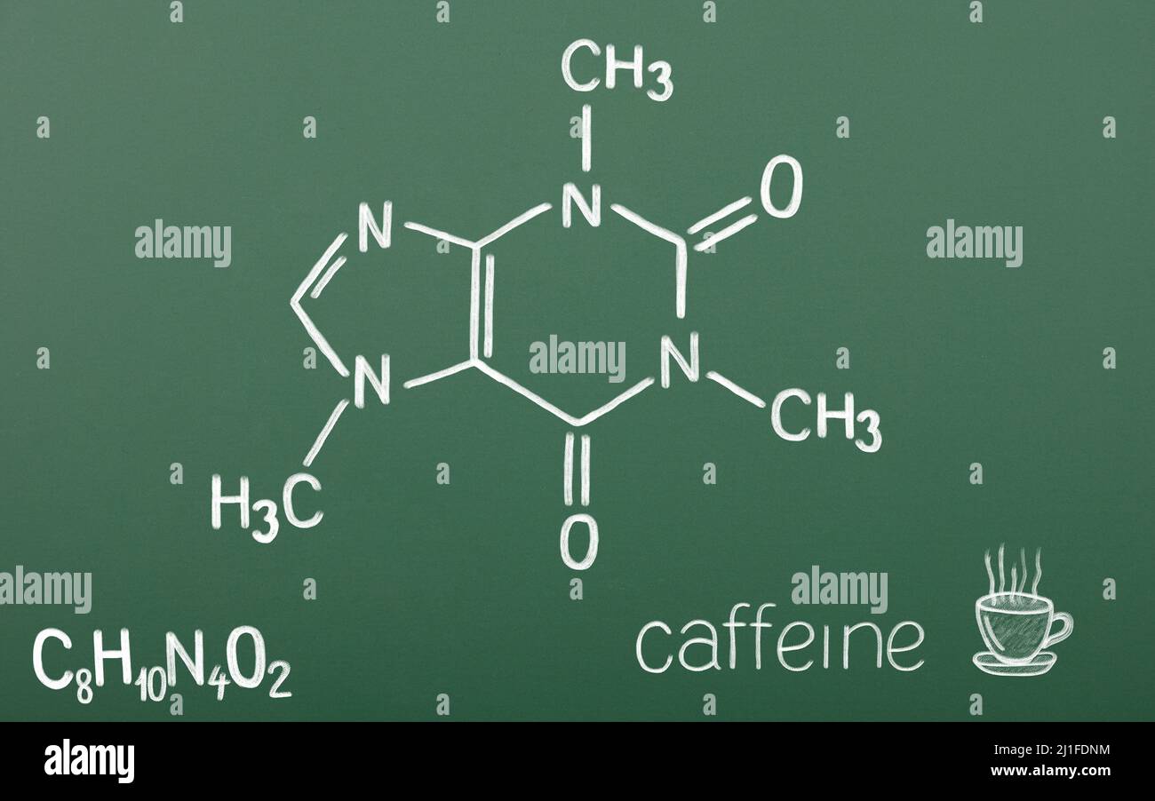 Chemical structural formula of caffeine drawn on chalkboard. Isolated ...