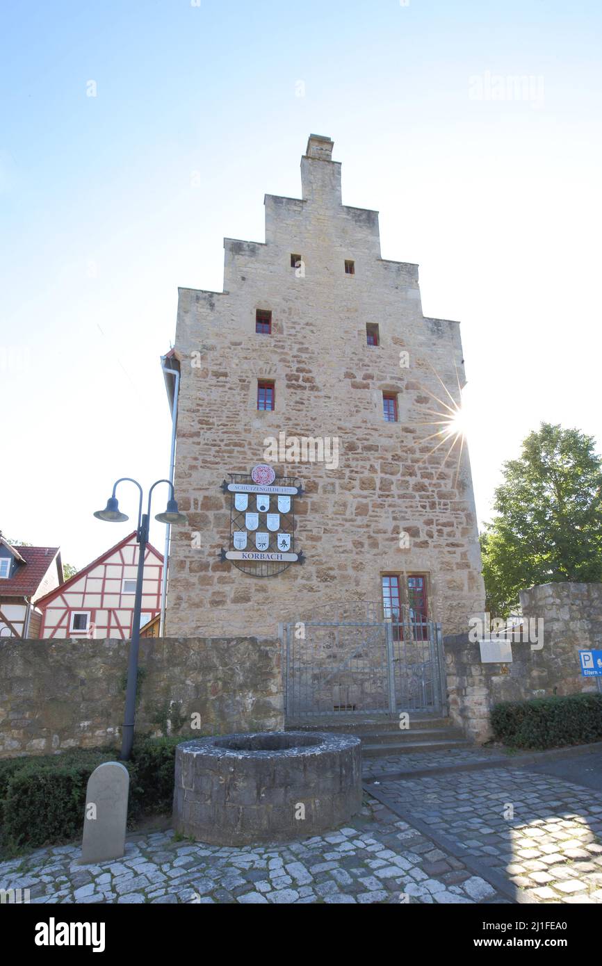 Gothic warehouse with stepped gable against the light in Korbach, Hesse ...