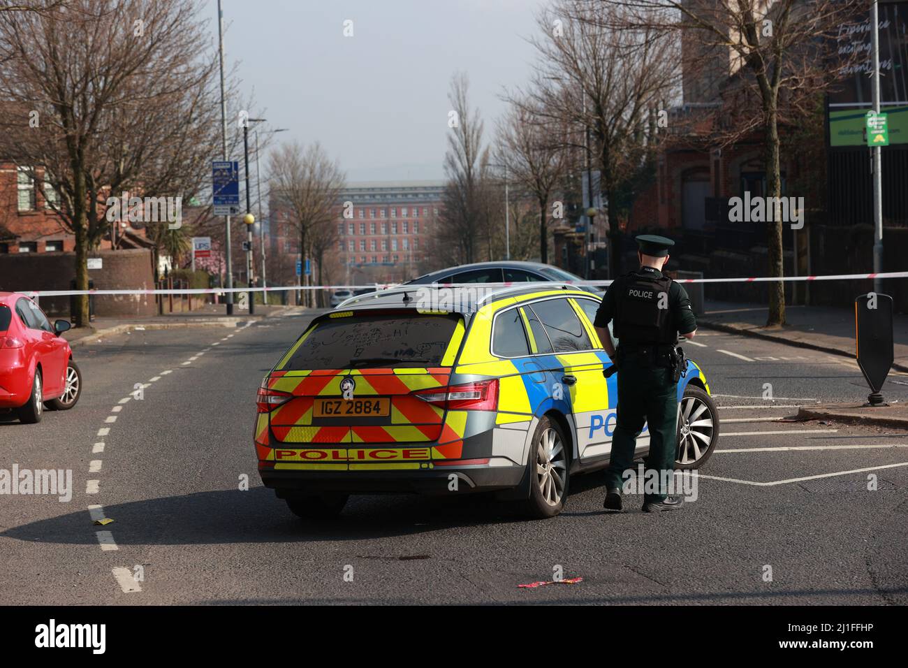 PSNI officers patrol a cordon at the Holy Cross church where emergency ...