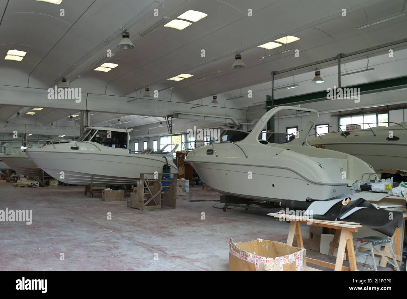 Indoor shipyard of speed boats in construction Stock Photo - Alamy