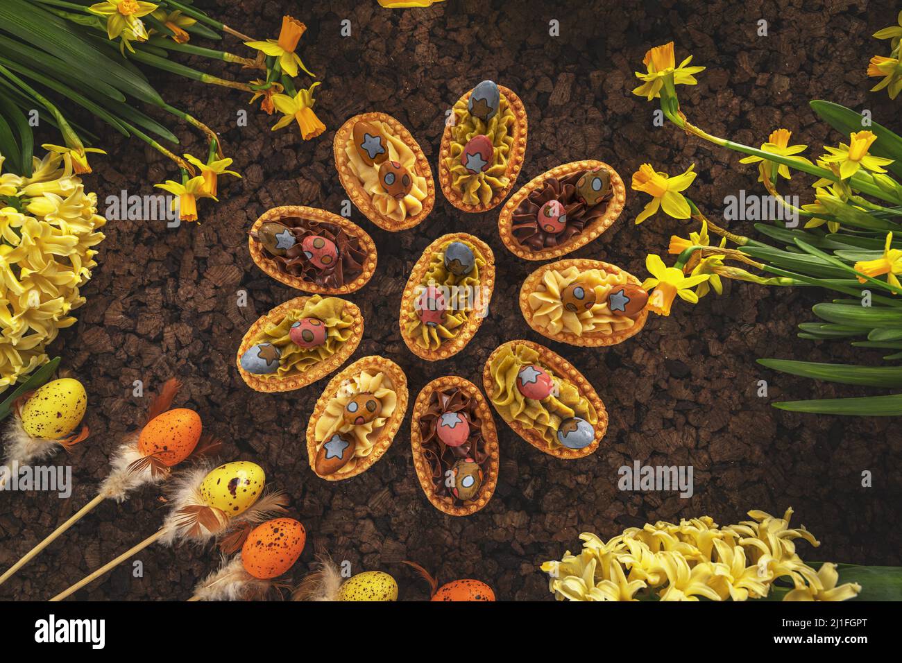 Still life of delicious mini tartlets dessert assorted pastries with ...