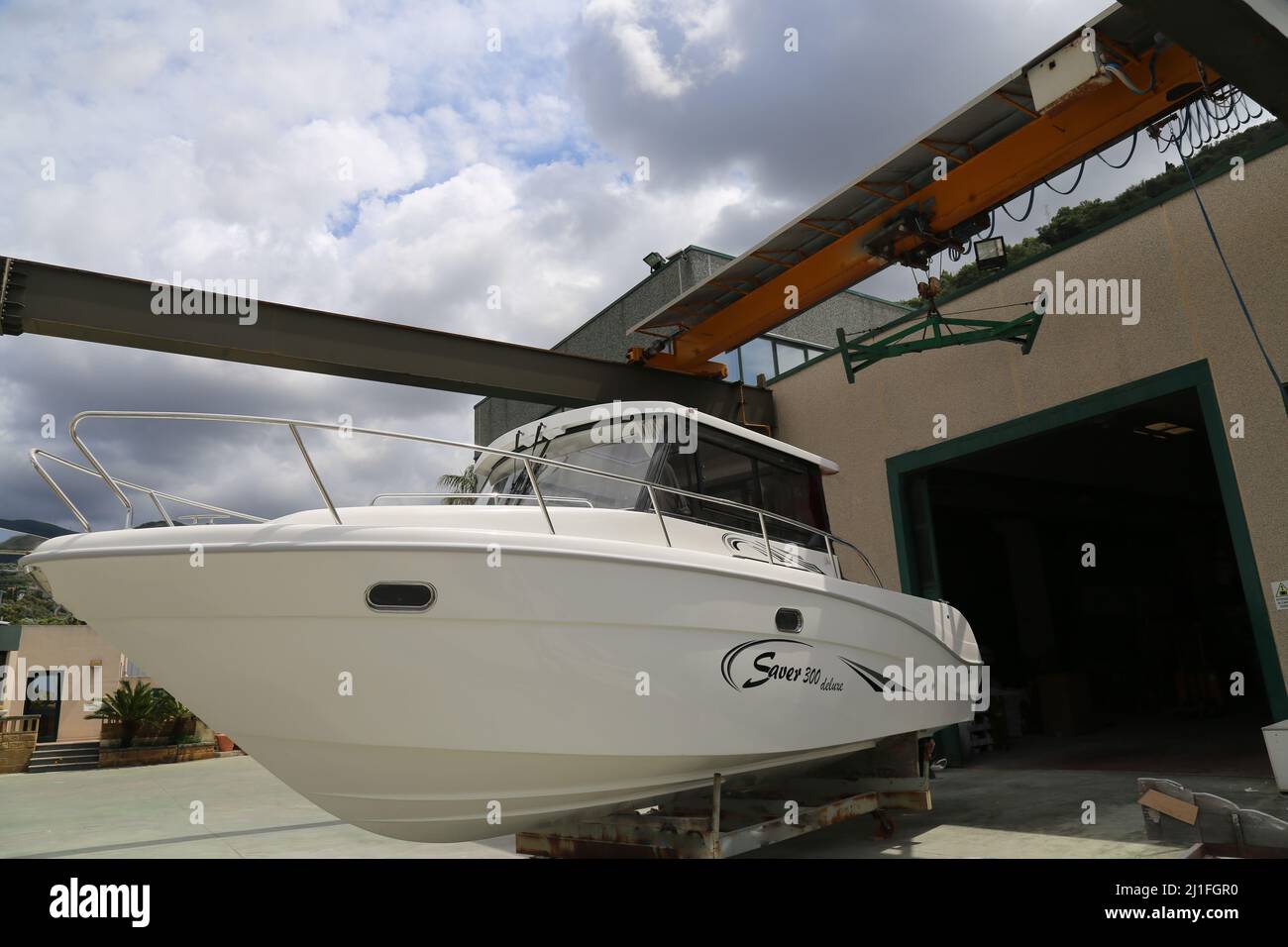 New speed boats in construction outside of the shipyard hangar Stock Photo - Alamy