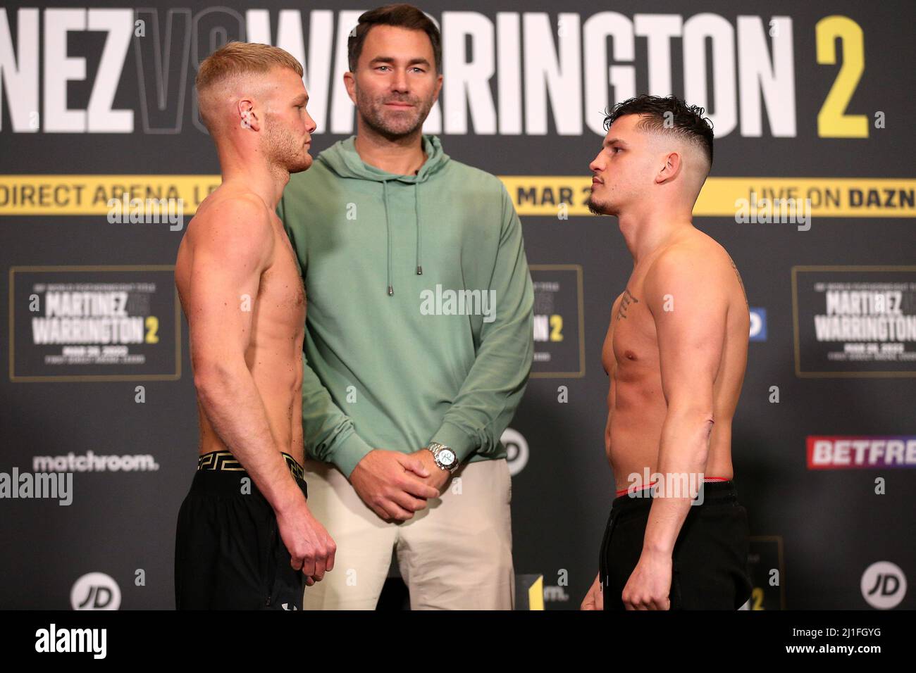 Calum French (left) and Angelo Turco face off as Eddie Hearn looks on ...