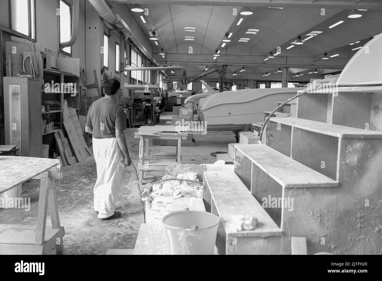Indoor shipyard of speed boats in construction Stock Photo - Alamy