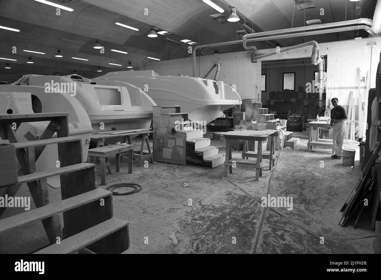 Indoor shipyard of speed boats in construction Stock Photo - Alamy