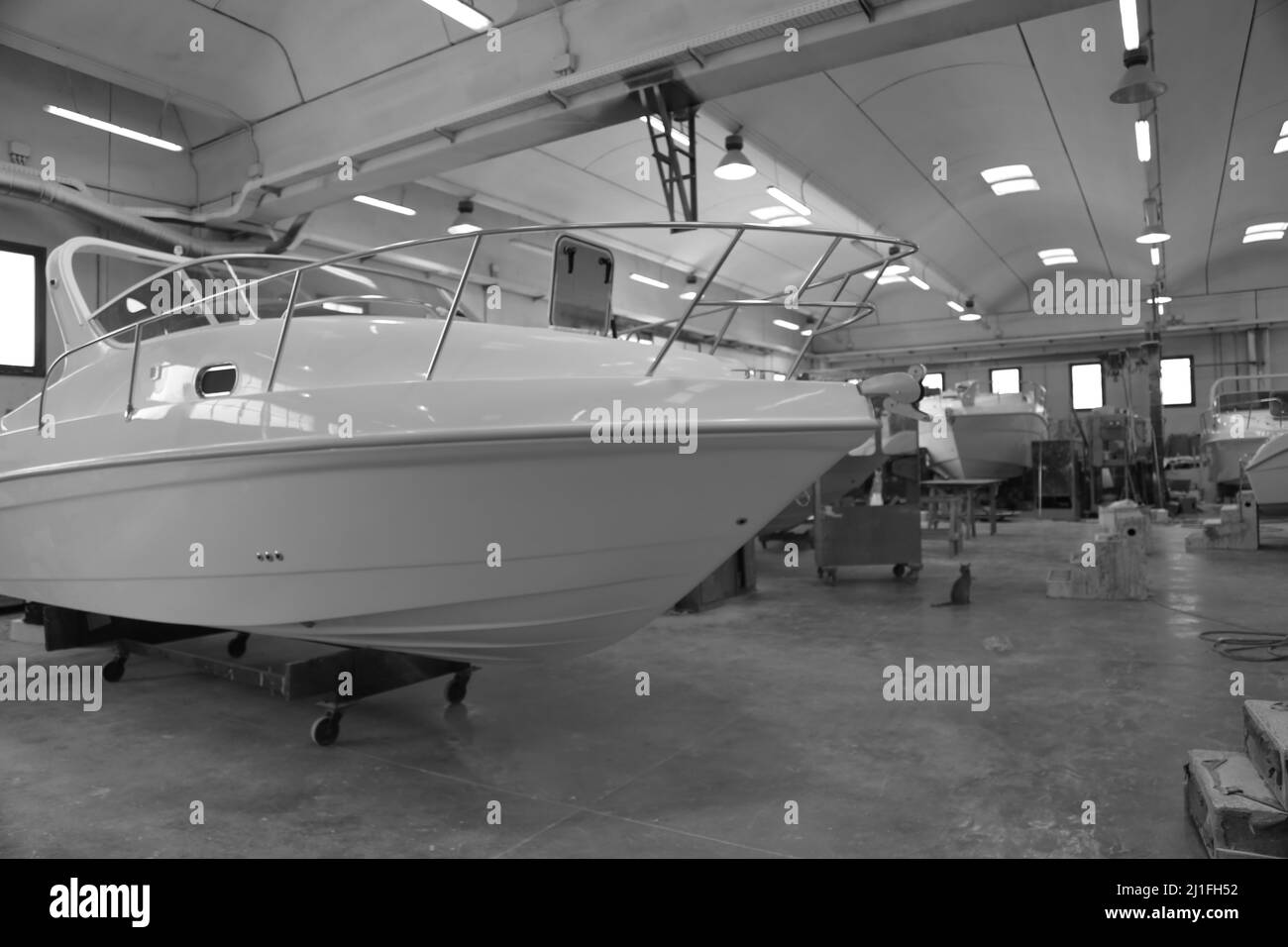 Indoor shipyard of speed boats in construction Stock Photo - Alamy