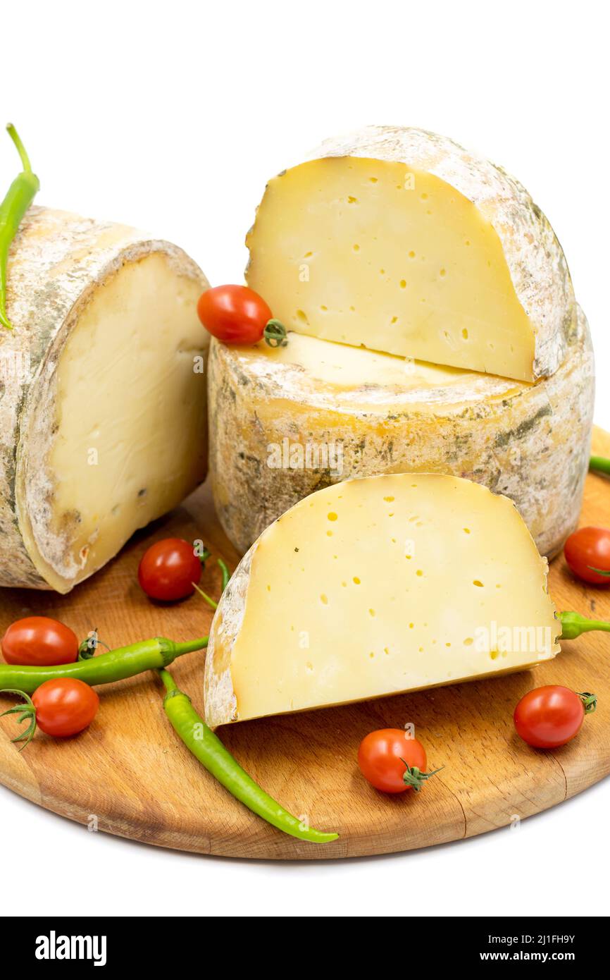 Goat cheddar cheese isolated on a white background. close up Stock ...