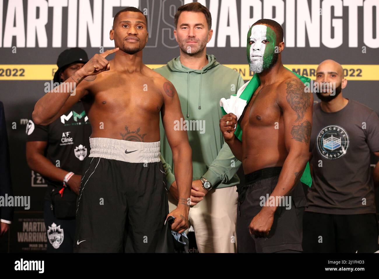 Mali Wright (left) and Luis Palmer face off as Eddie Hearn looks on during the weigh in at The ...