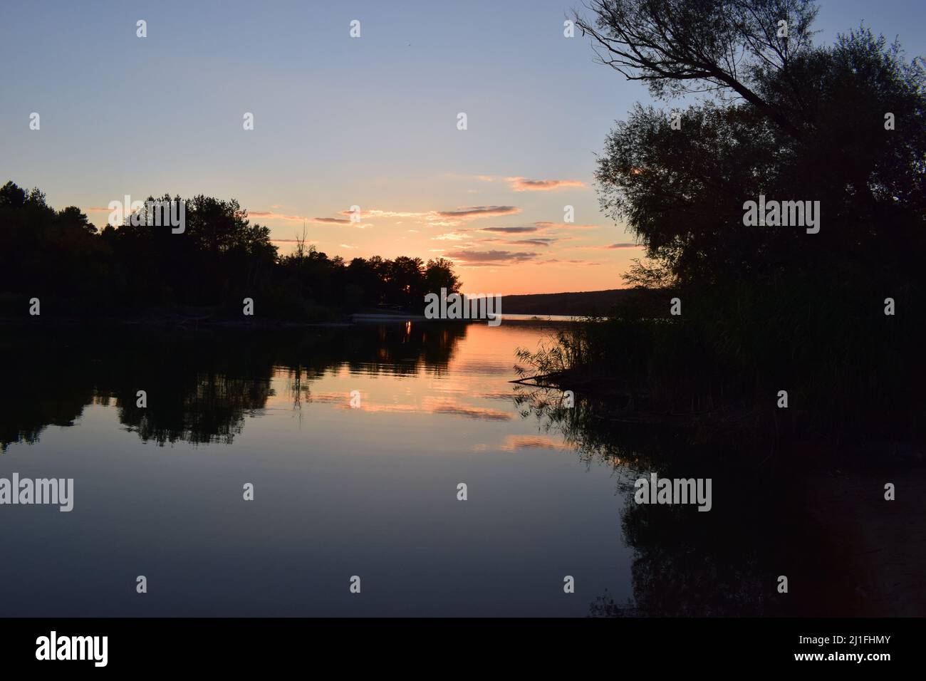 Majestic colorful sunset over forest lake in nature reserve. Beautiful ...