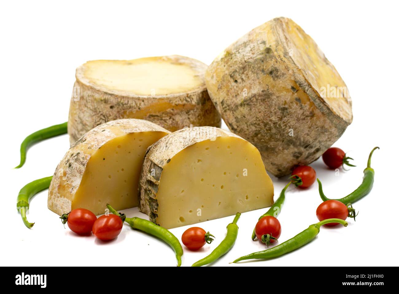 Goat cheddar cheese isolated on a white background. close up Stock ...