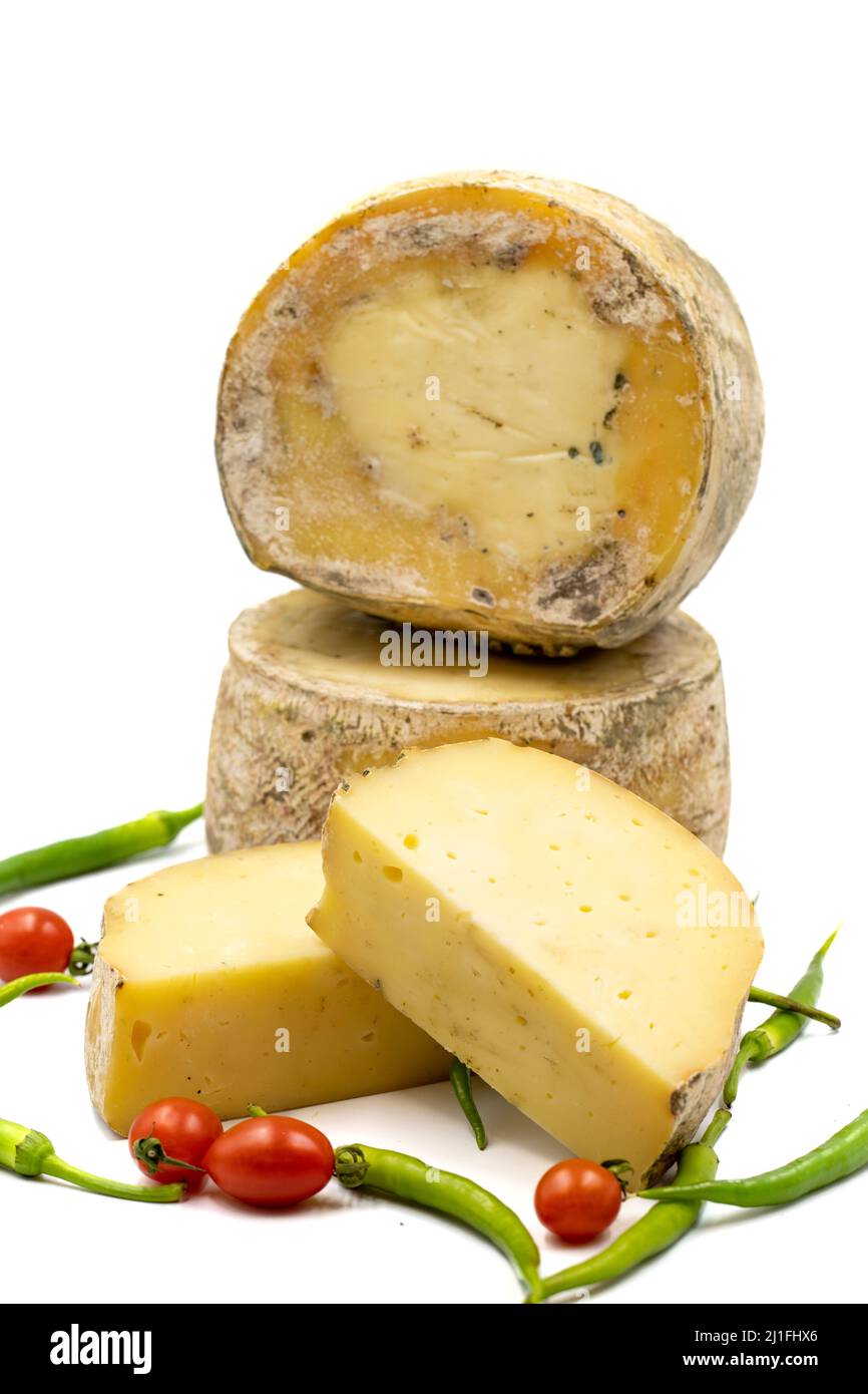 Goat cheddar cheese isolated on a white background. close up Stock ...