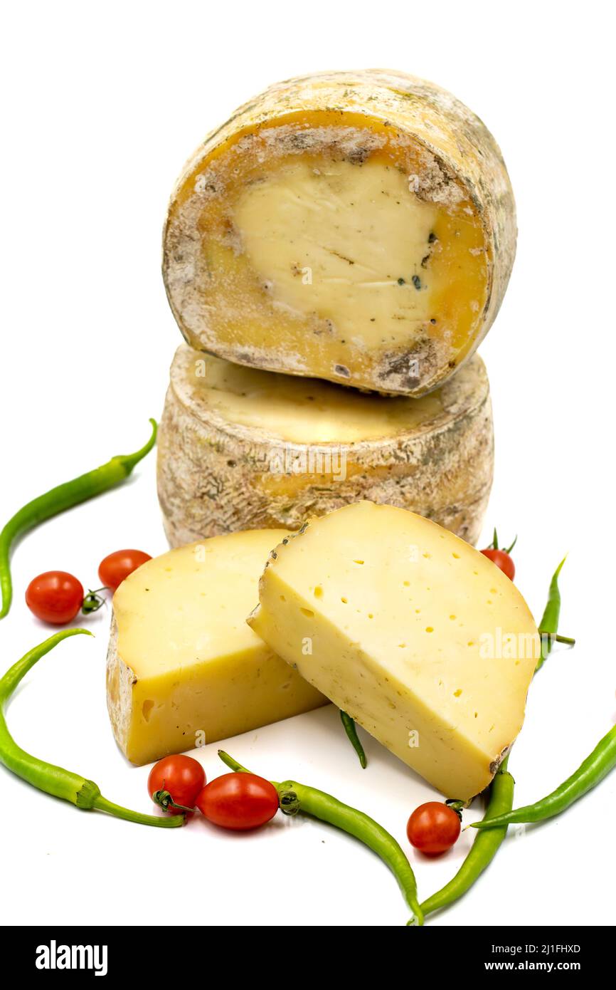 Goat cheddar cheese isolated on a white background. close up Stock ...