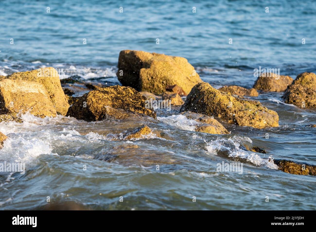waves flowing over sea Groynes Stock Photo - Alamy