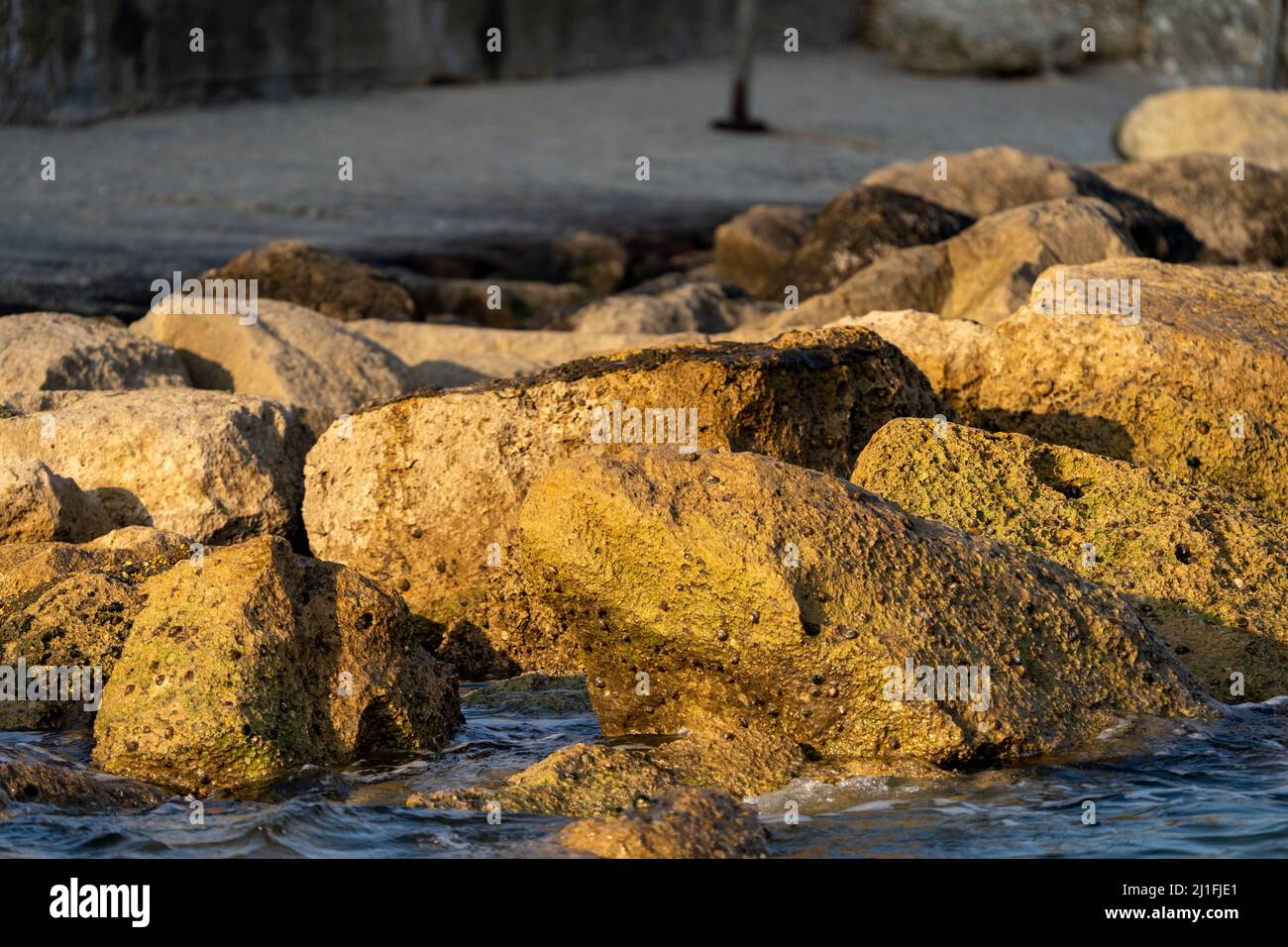 Rock Groyne Sea Defence At Sunset Stock Photo - Alamy