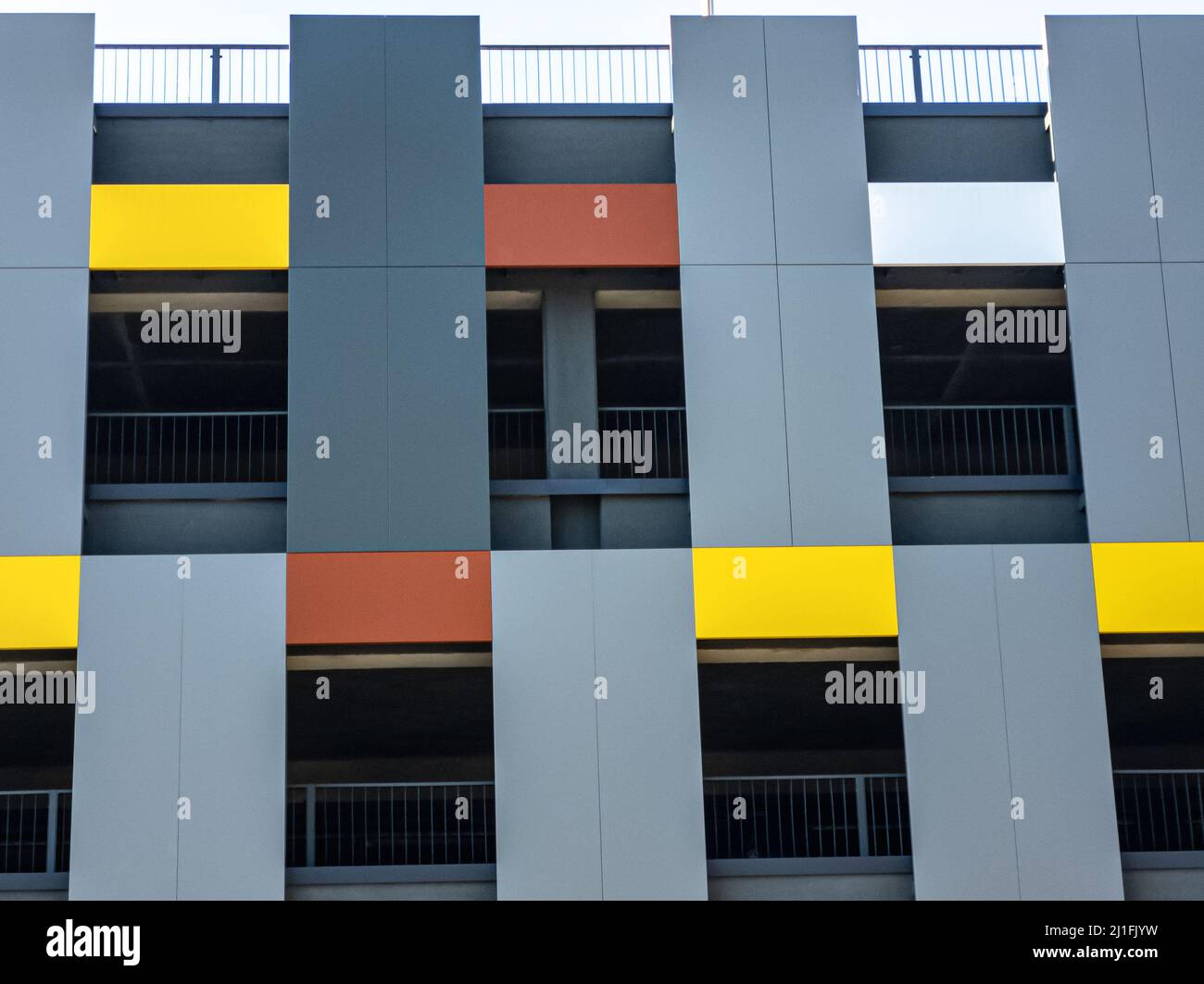 Multi-level parking building for cars. Facade with original colorful ...