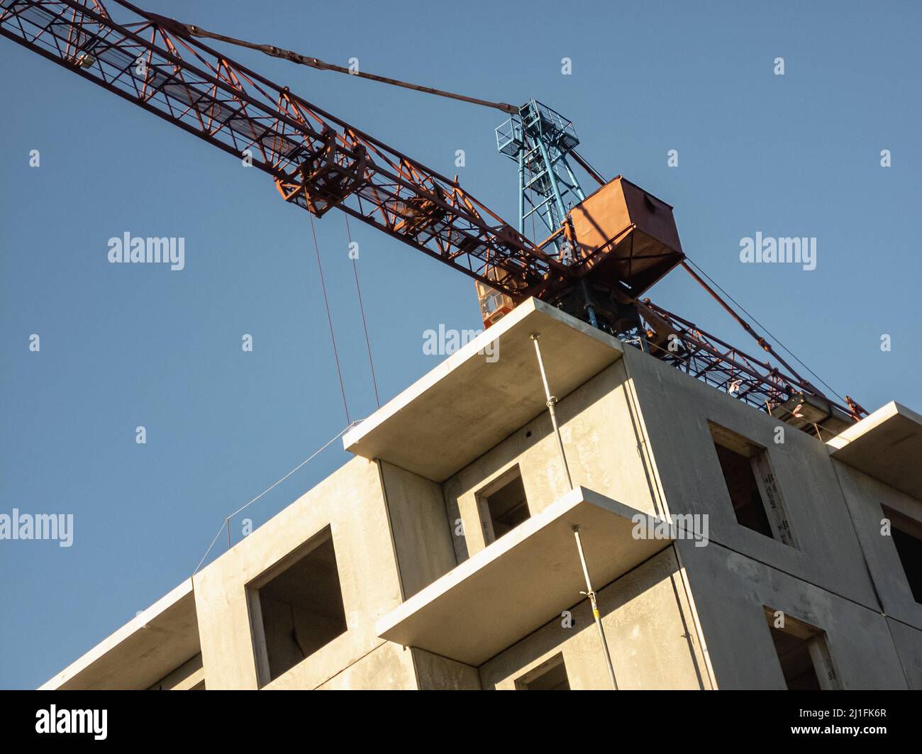 Tower cranes at the construction site. Construction of panel high-rise ...