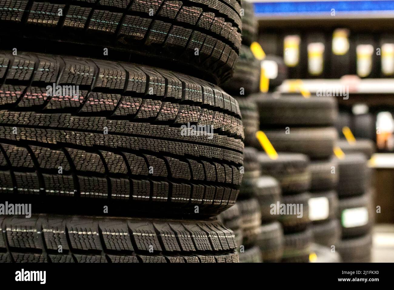 Car tires and wheels at warehouse in tire store Stock Photo - Alamy