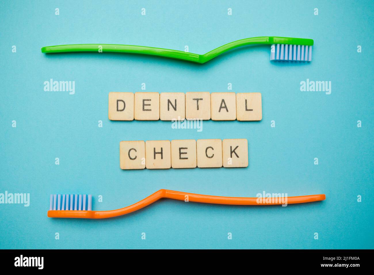 Oral and dental health concept showing two toothbrushes and a sign ...