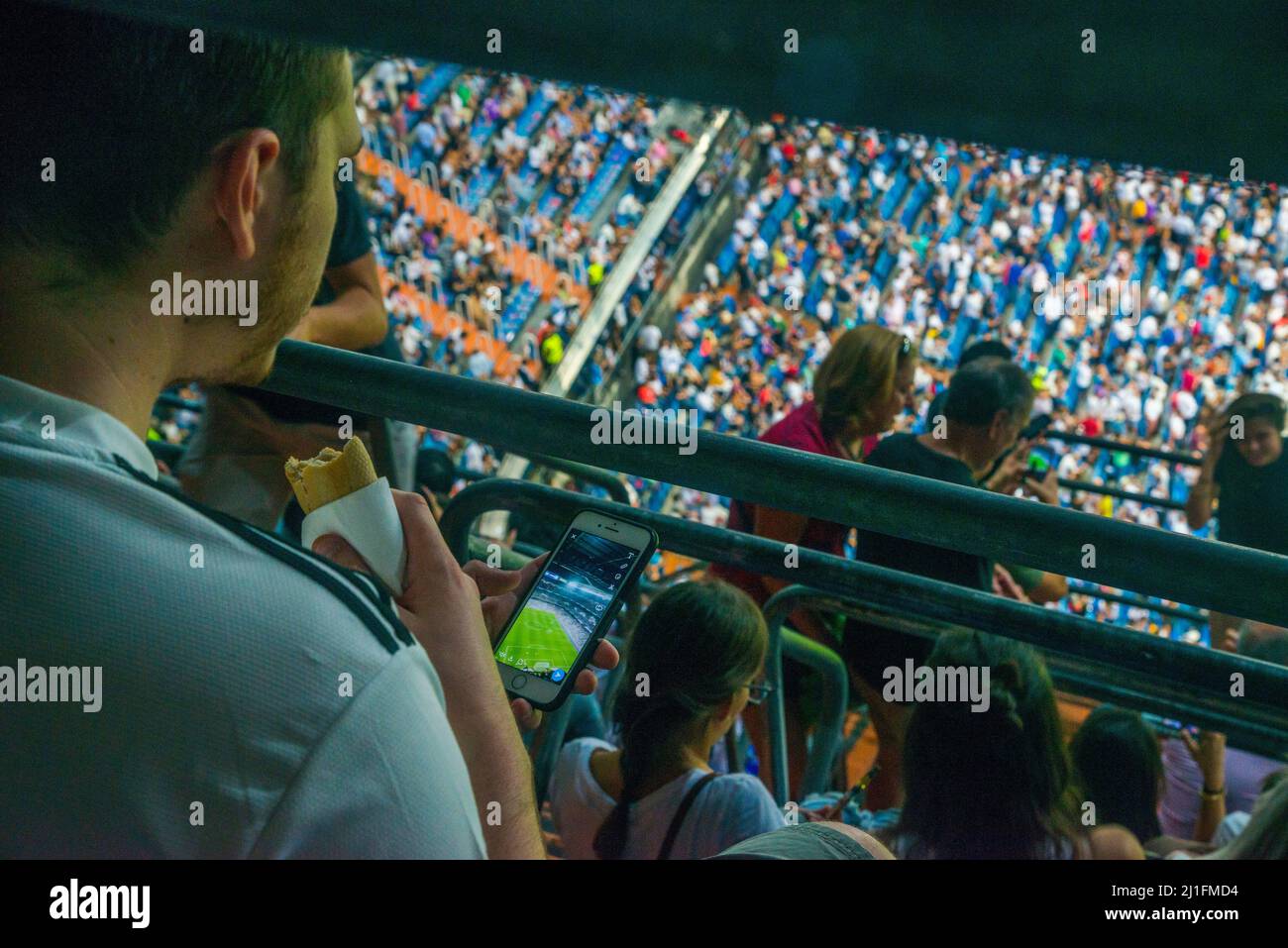 Spectators in a football match. Santiago Bernabeu stadium, Madrid ...