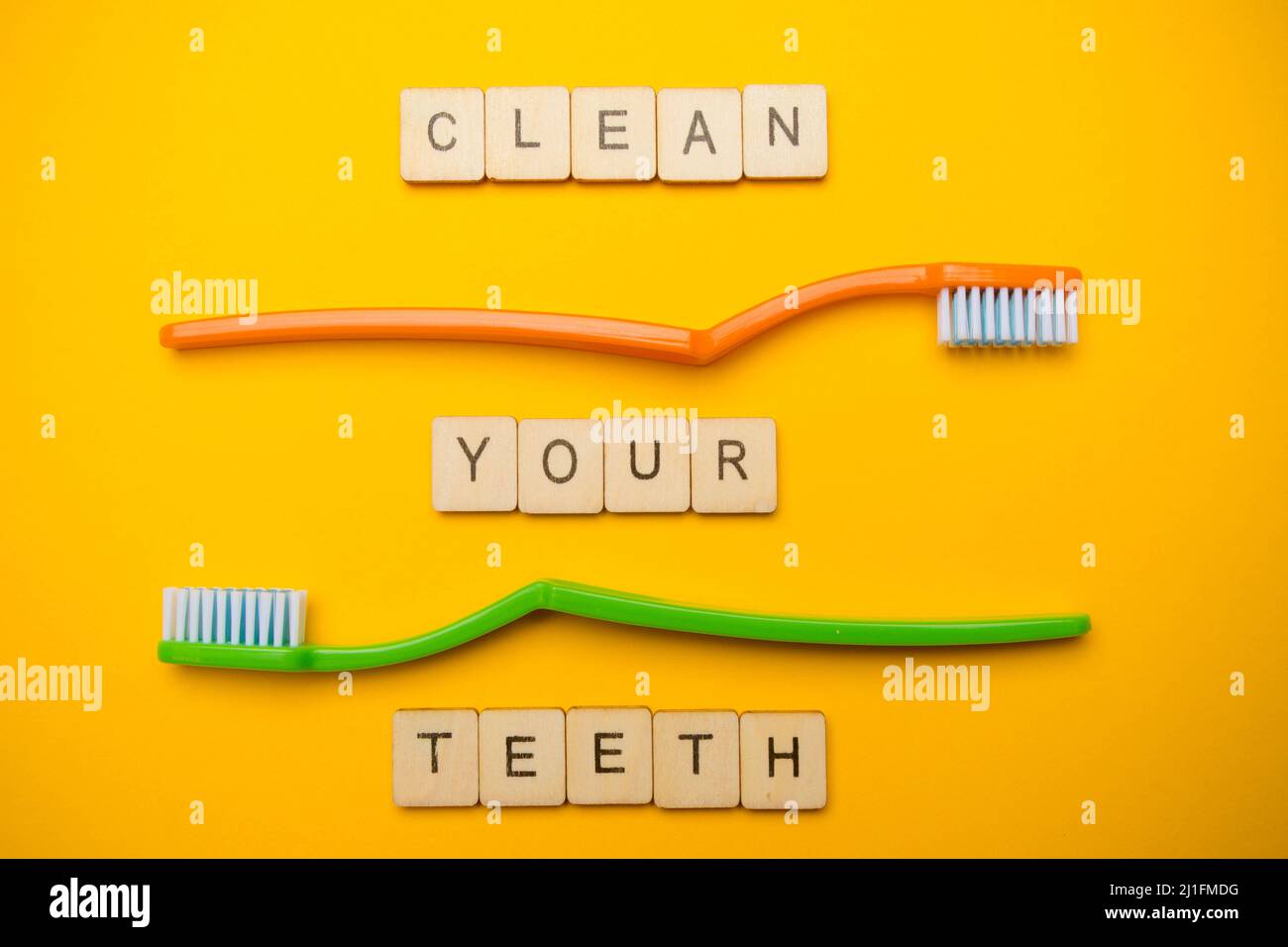 Oral and dental health concept showing two toothbrushes and a sign ...