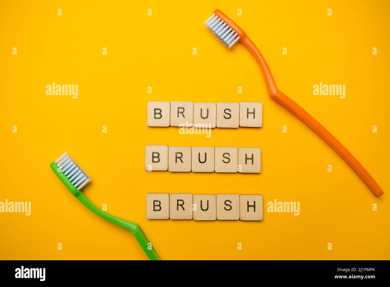 Oral and dental health concept showing two toothbrushes and a sign ...