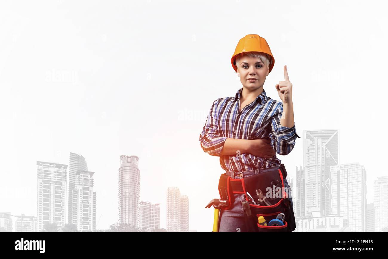 Beautiful female builder in hardhat Stock Photo - Alamy