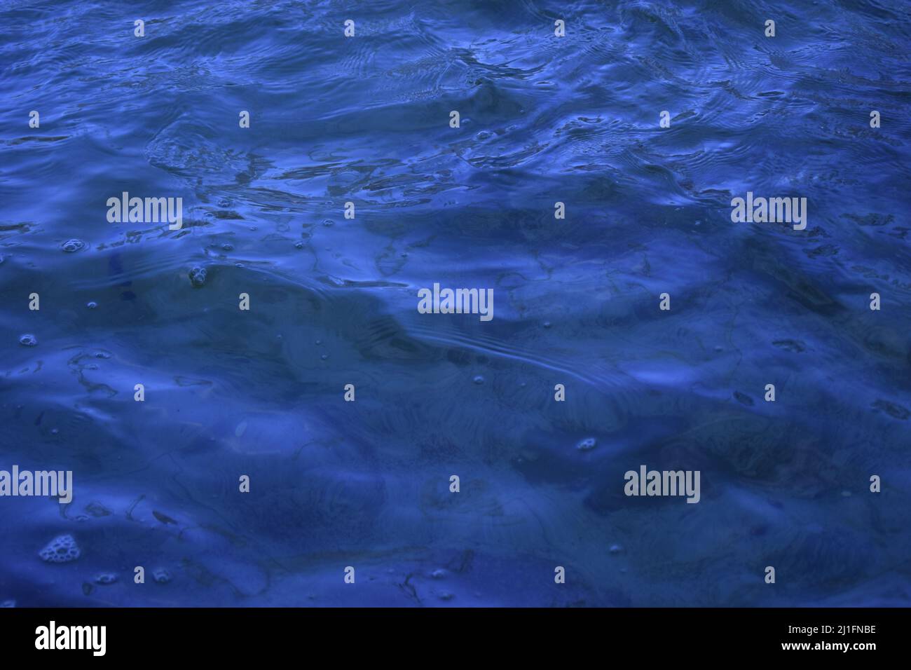 Dark blue wavy water surface. Swimming pool water texture. Blue liquid ...