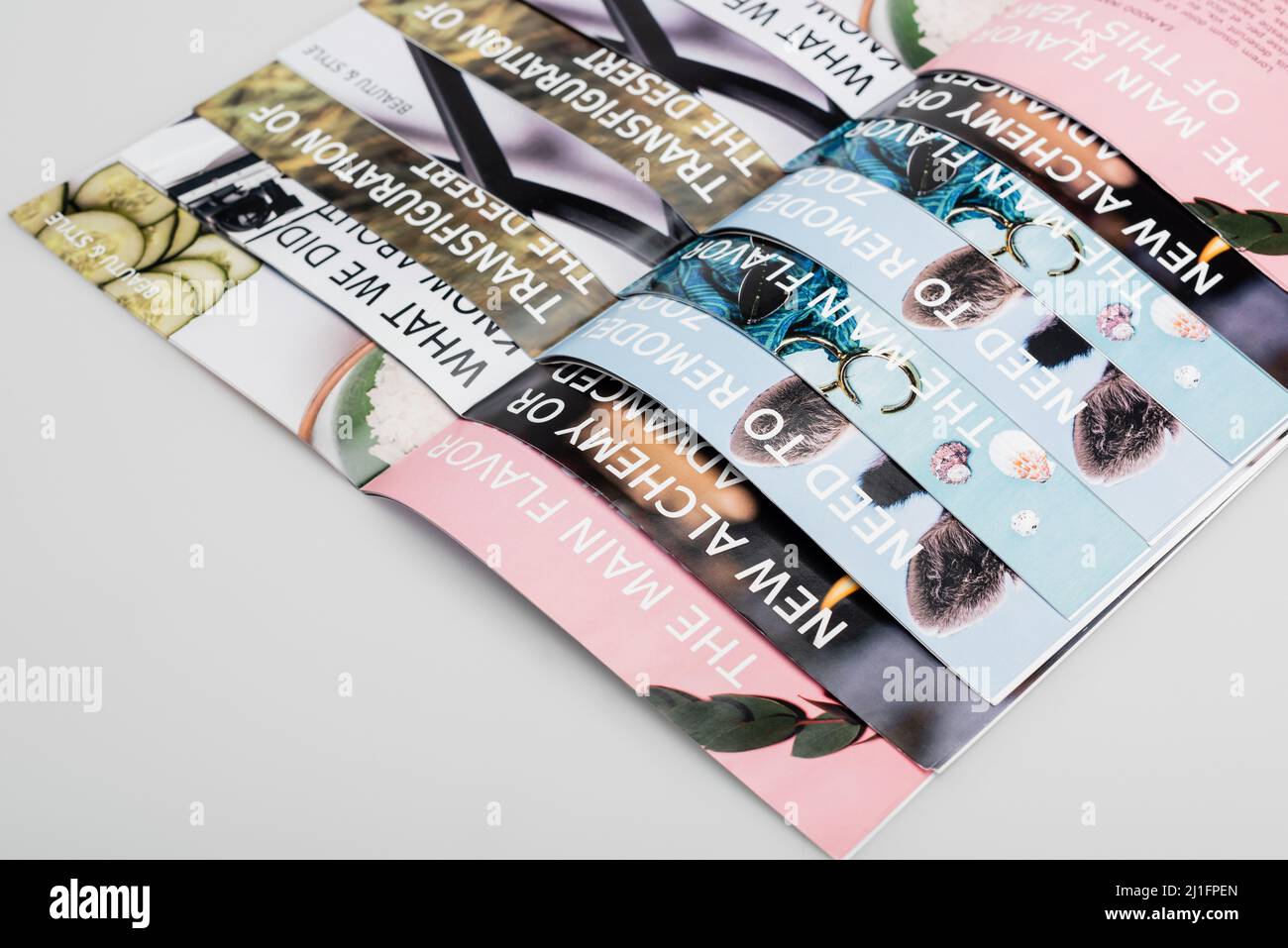top view of several beauty magazines on grey background Stock Photo - Alamy