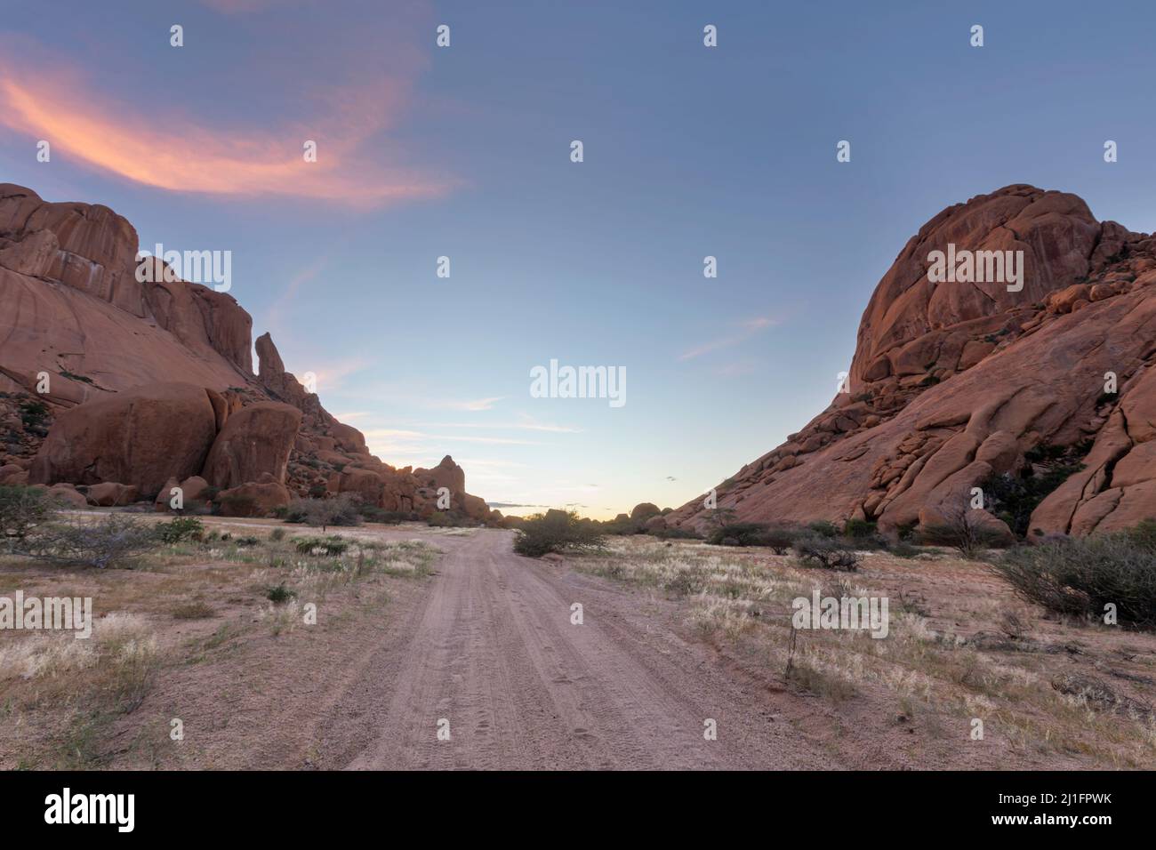 Pink cloud and blue sky before sunrise at Spitzkoppe Namibia Stock ...