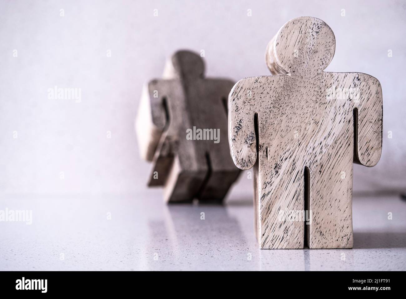 figures of man and woman made with wood on a neutral background Stock ...